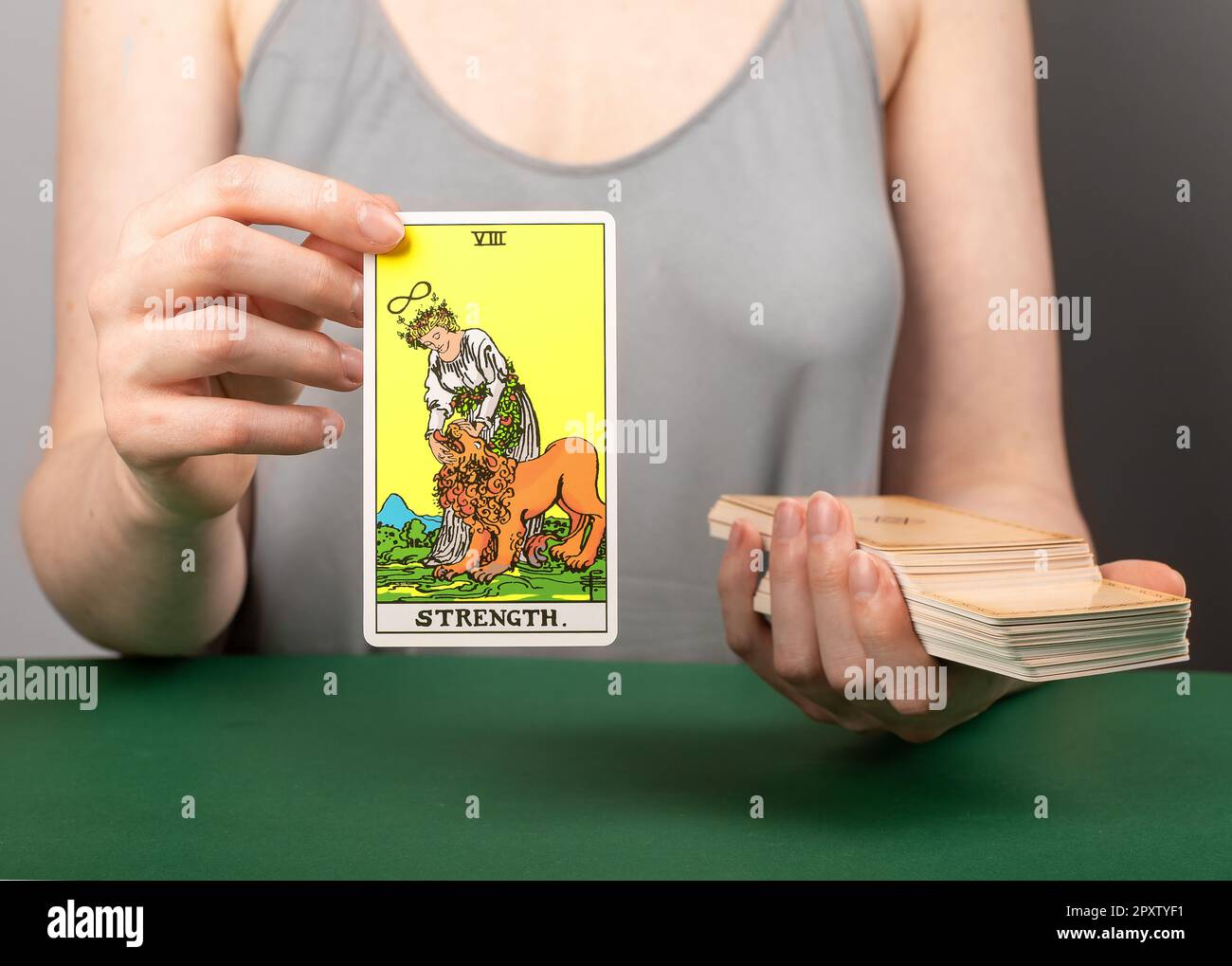 Lodz Poland April 15 2023 Strength arcana, hand holding showing tarot ...