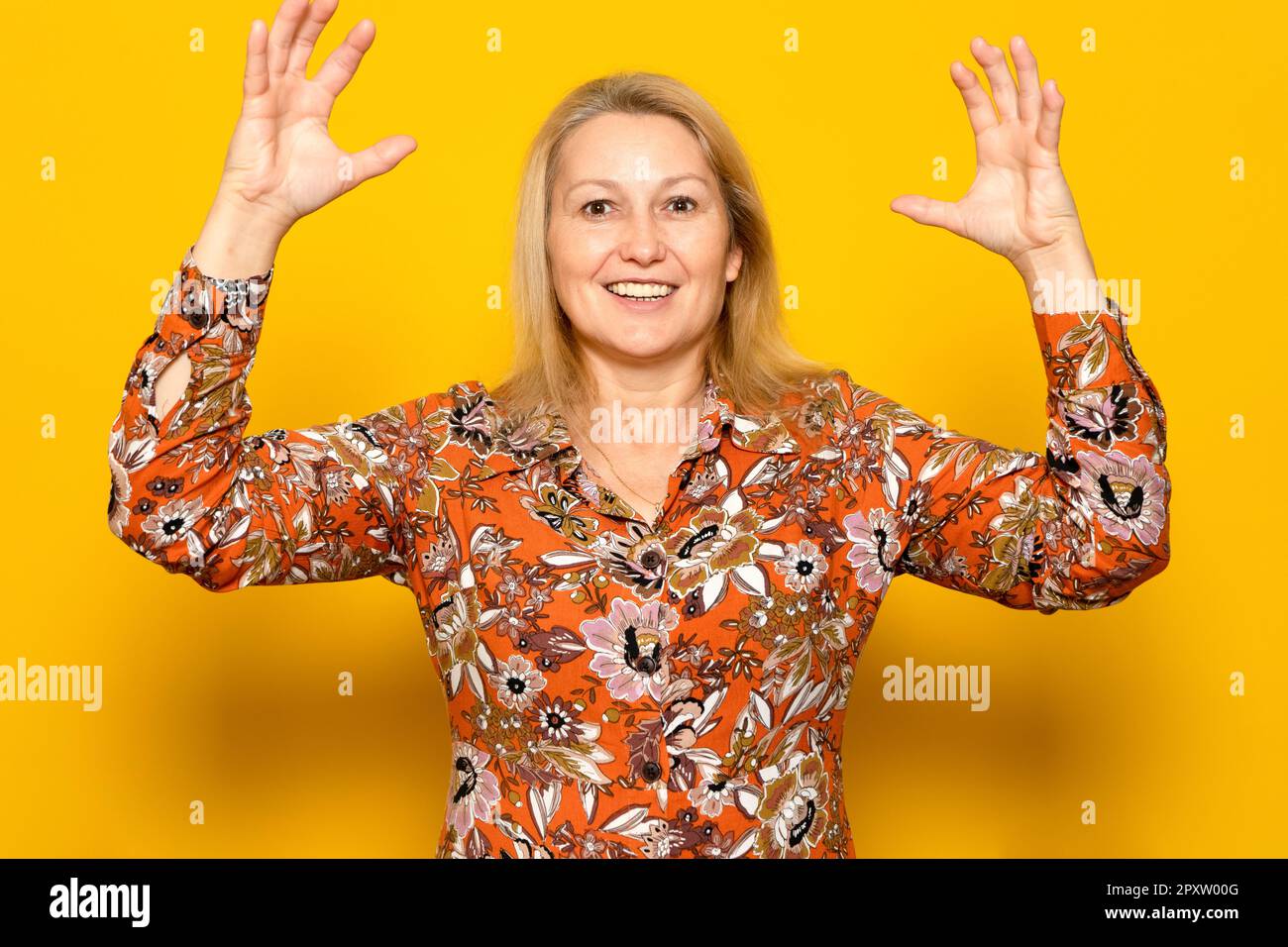 Blonde Caucasian woman in her 40s tremendously surprised by an ...