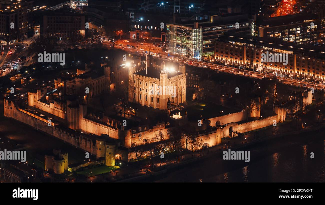 Aerial view of illuminated London tower, orange yellow street lights ...