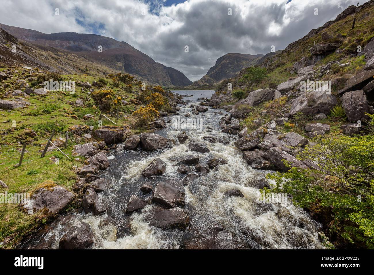 River Loe in Gap of Dunloe mountain pass separating the MacGillycuddy ...