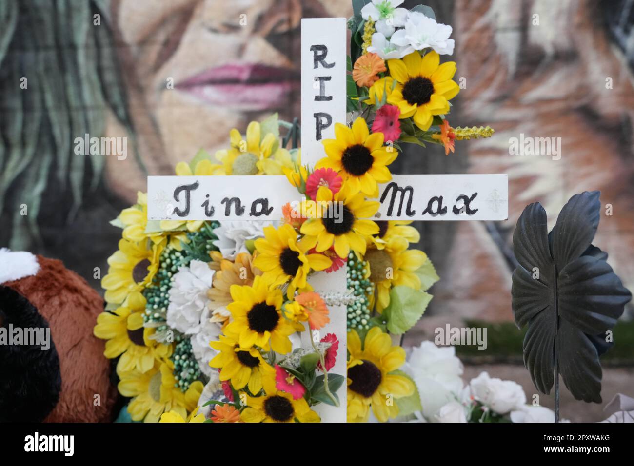 A memorial for Tina Tintor, 23, and her golden retriever pet dog ...