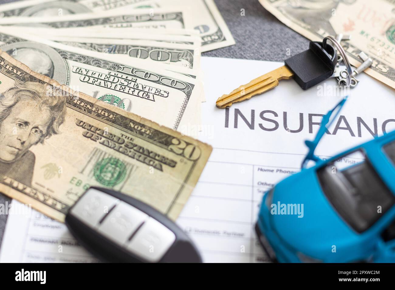 Car insurance form with car key and toy car Stock Photo - Alamy