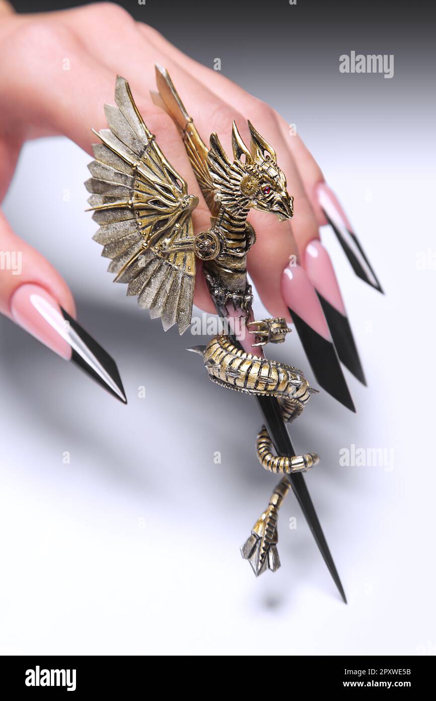 Creative design of nails on female hands. Art manicure. Photo taken in ...