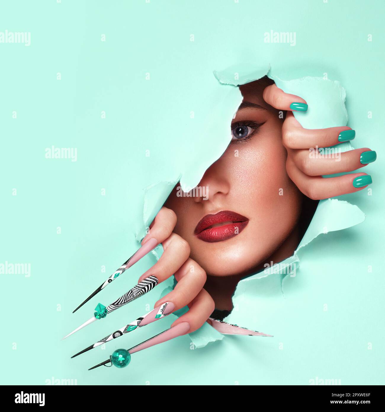 Portrait of a beautiful woman with art make up in glamorous style ...