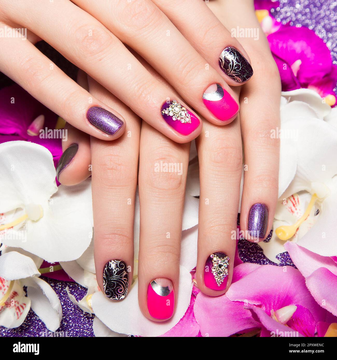 Beautiful colorful manicure with bubbles and crystals on female hand ...