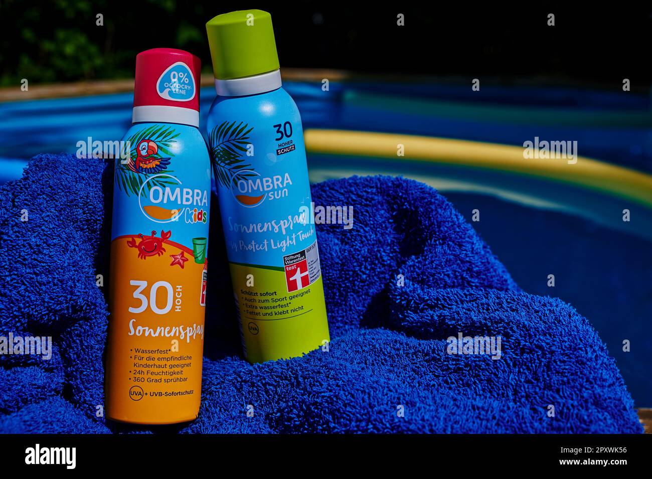 Berlin, Germany - July 24, 2022: Anti-sunburn spray on a blue towel by ...