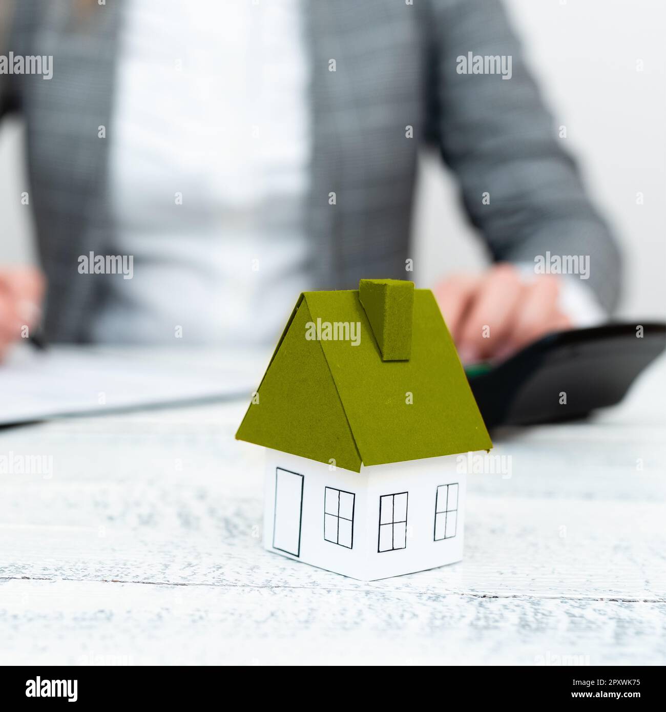 Businessman on house roof hi-res stock photography and images - Alamy