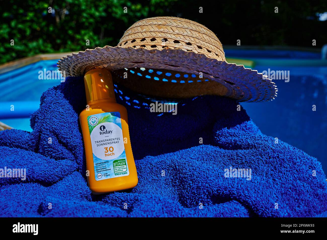 Berlin, Germany - July 24, 2022: Anti-sunburn spray on a blue towel by ...