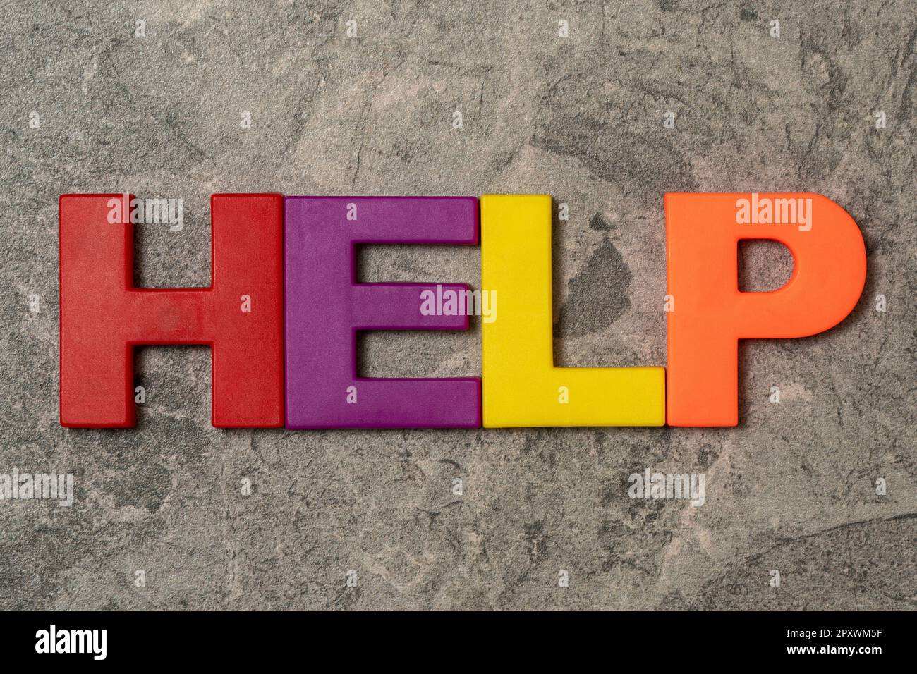 Word HELP made of colored plastic letters. Help or assistance concept ...