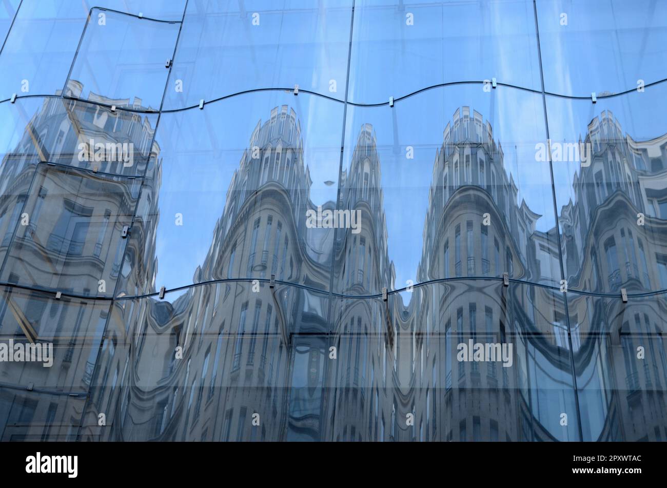Paris, France - March 18, 2023: Buildings reflected on the new ...