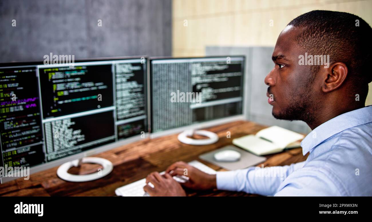 African American Coder Using Computer At Desk. Web Developer Stock ...