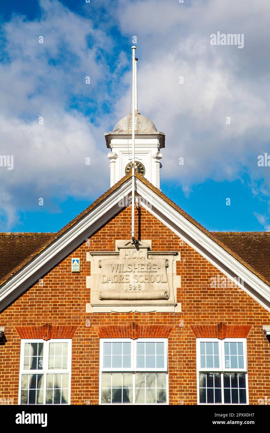 Plaque on the exterior of Wilshere-Dacre Junior Academy building with ...