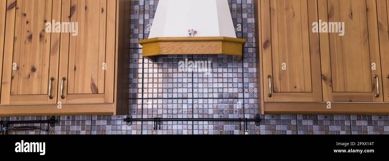 Elegant extractor fan in the kitchen , rustic style. Country style and ...