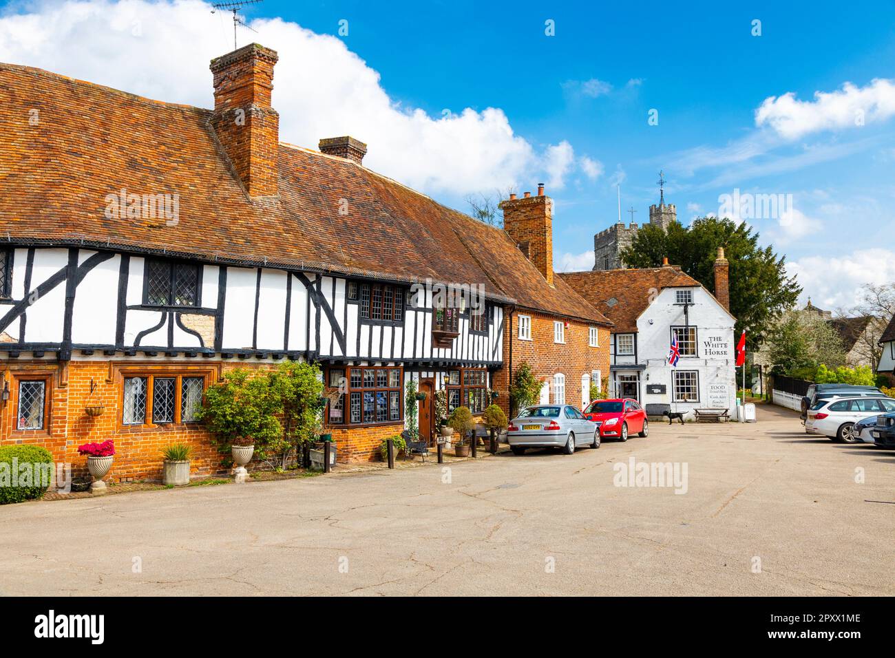 Village square with half-timbered historic houses and 14th century ...