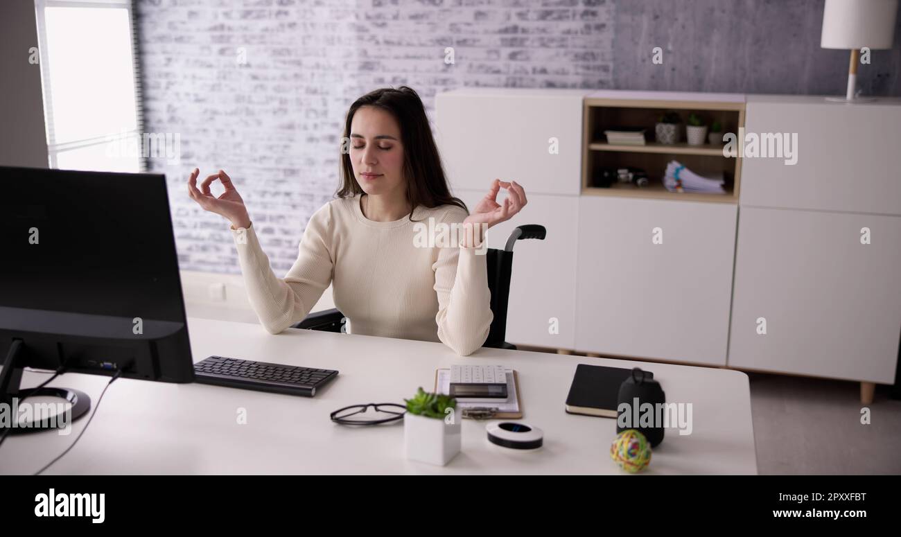 Healthy Yoga Meditation Exercise In Office Chair At Workplace Stock ...