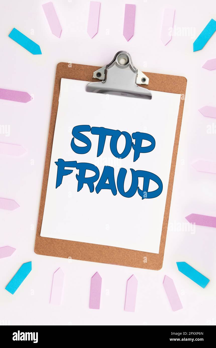 Sign displaying Stop Fraud, Word Written on campaign advices people to ...