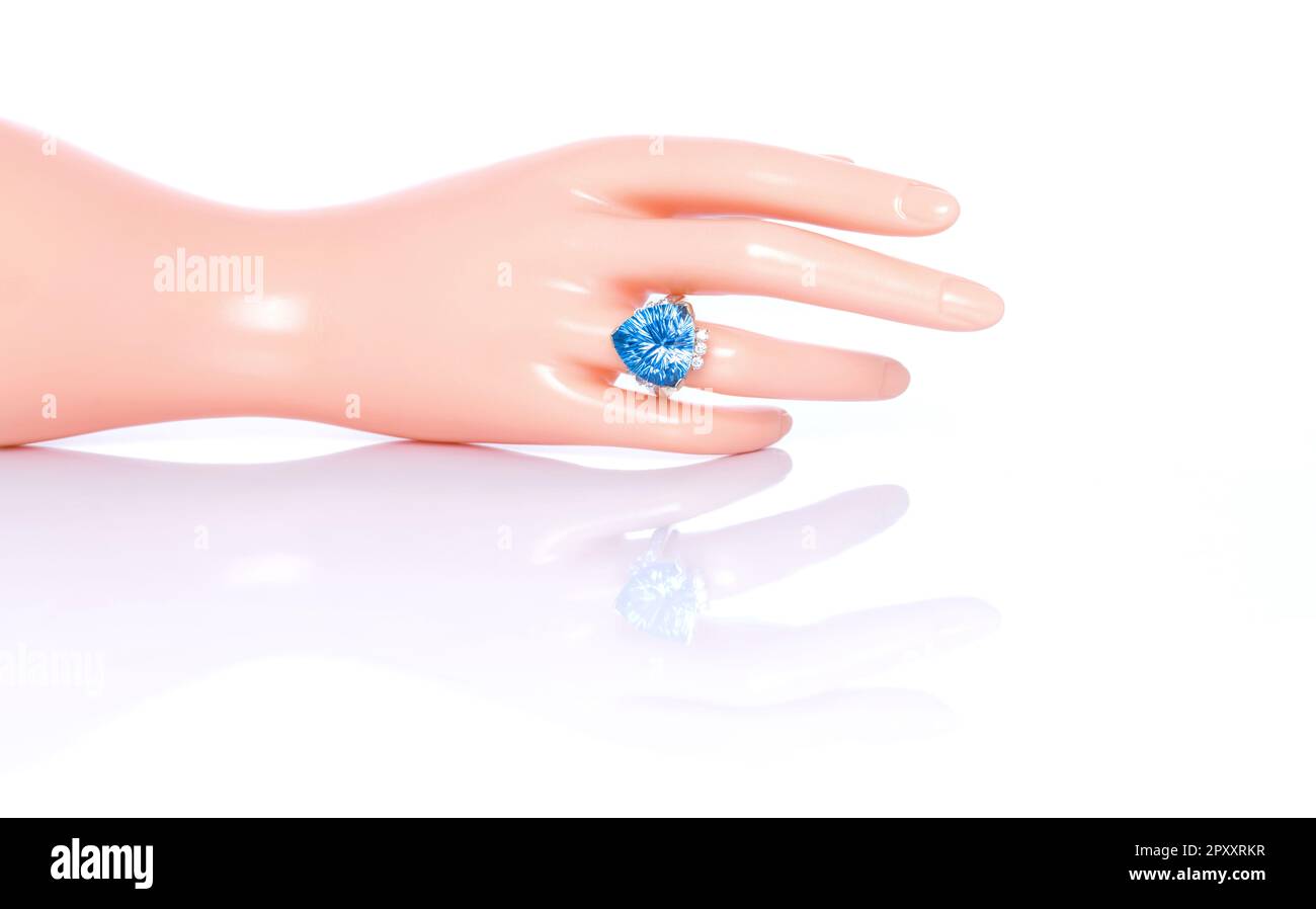 Swiss Blue Topaz concave cut and diamond ring on plastic mannequin ...