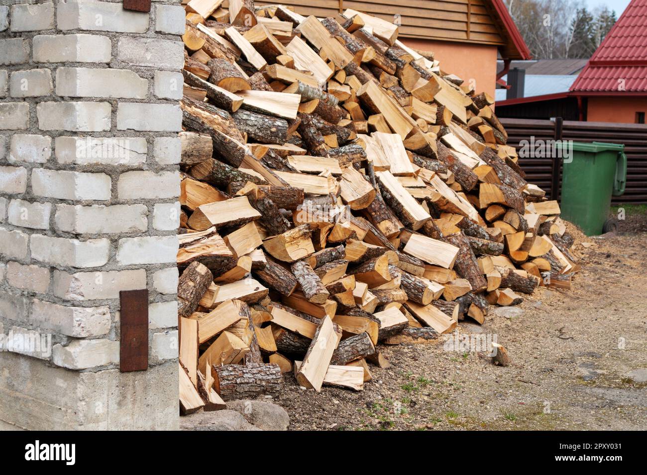 There is a pile of broken wood outside the house Stock Photo - Alamy