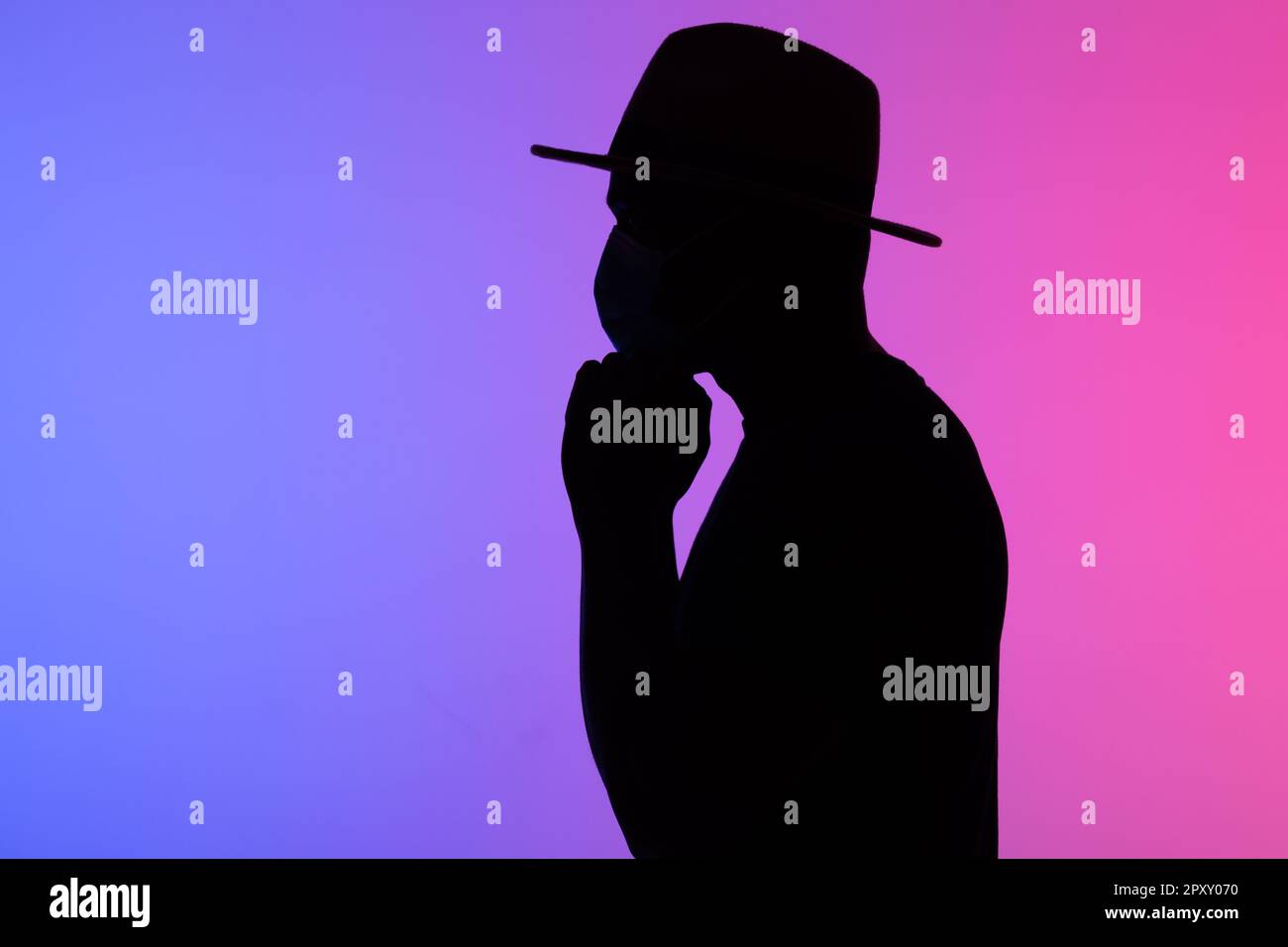 Silhouette african american man in hat against the colourful background ...