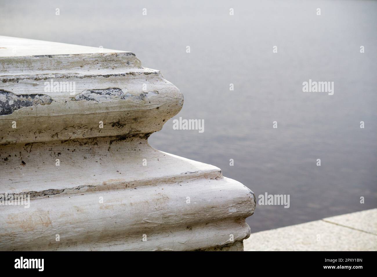A white column with a black stripe on the top Stock Photo - Alamy