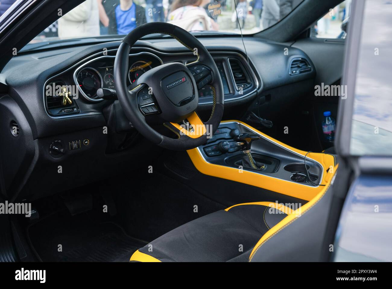 A close-up shot of a yellow and black Dodge race car from the interior ...
