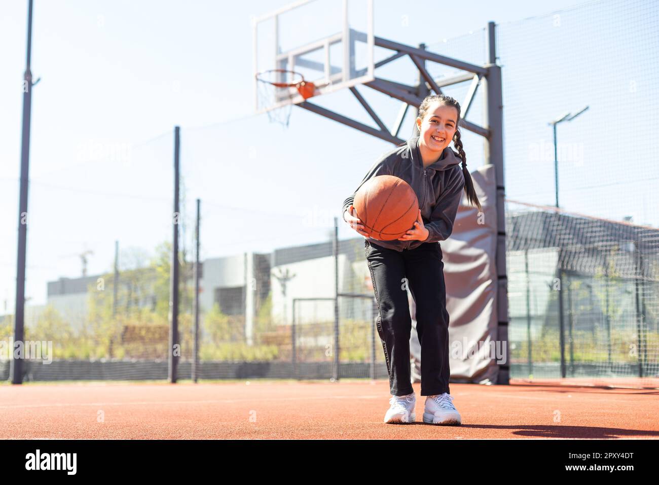 beautiful girl shooting basket and playing basketball Stock Photo - Alamy
