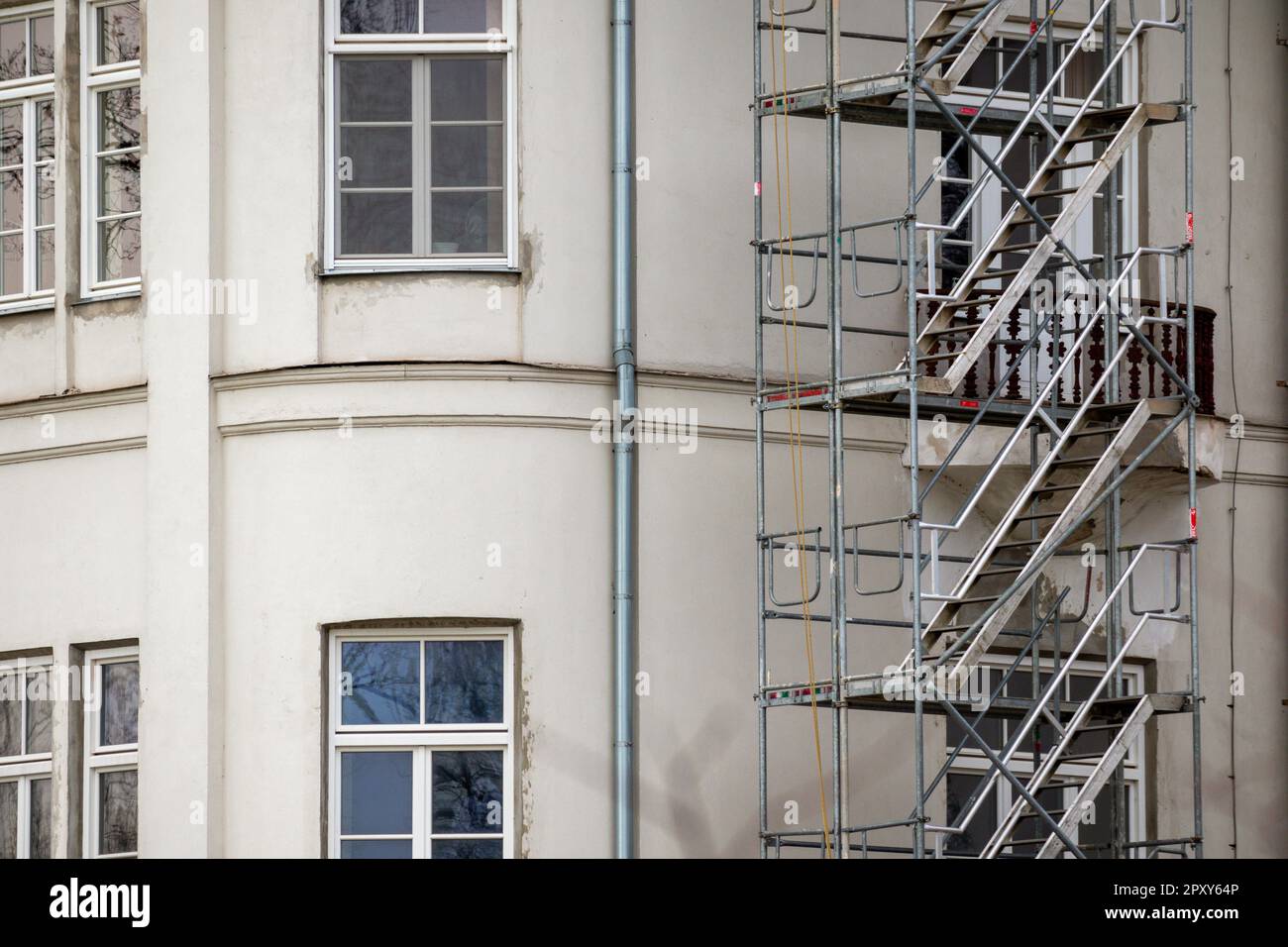 A building with a construction ladder on it Stock Photo - Alamy