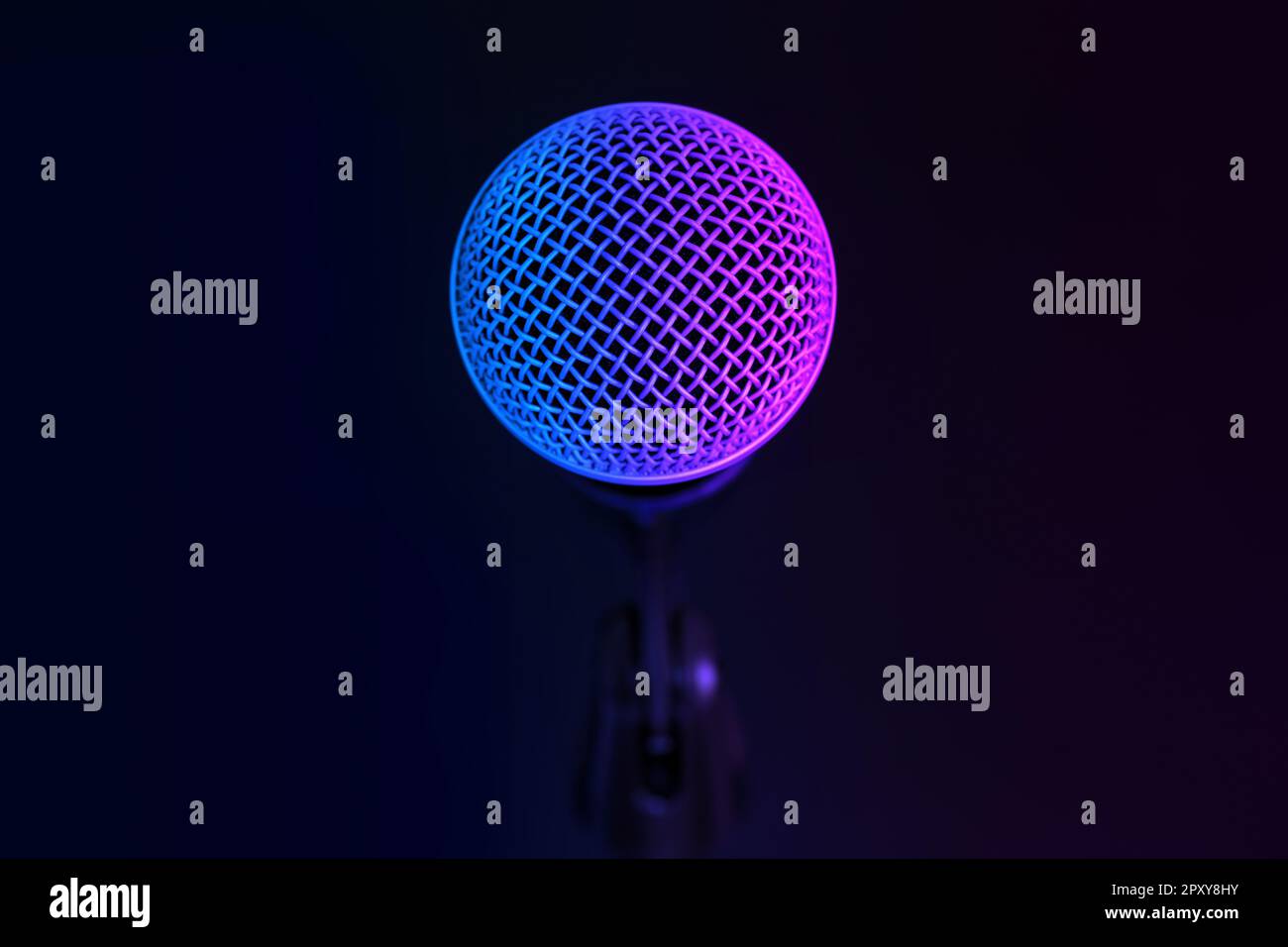 close font view of a profosssionnal microphone, gradient purple ...