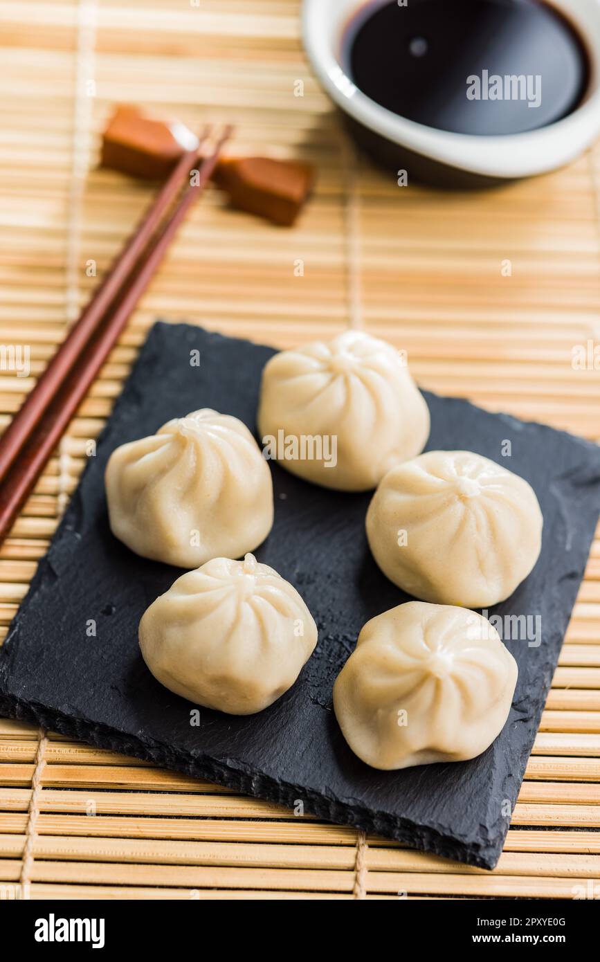Xiaolongbao, traditional steamed dumplings and soy sauce. Xiao Long Bao ...