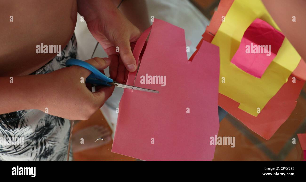 Children doing art and craft, child cutting paper with scissors Stock ...
