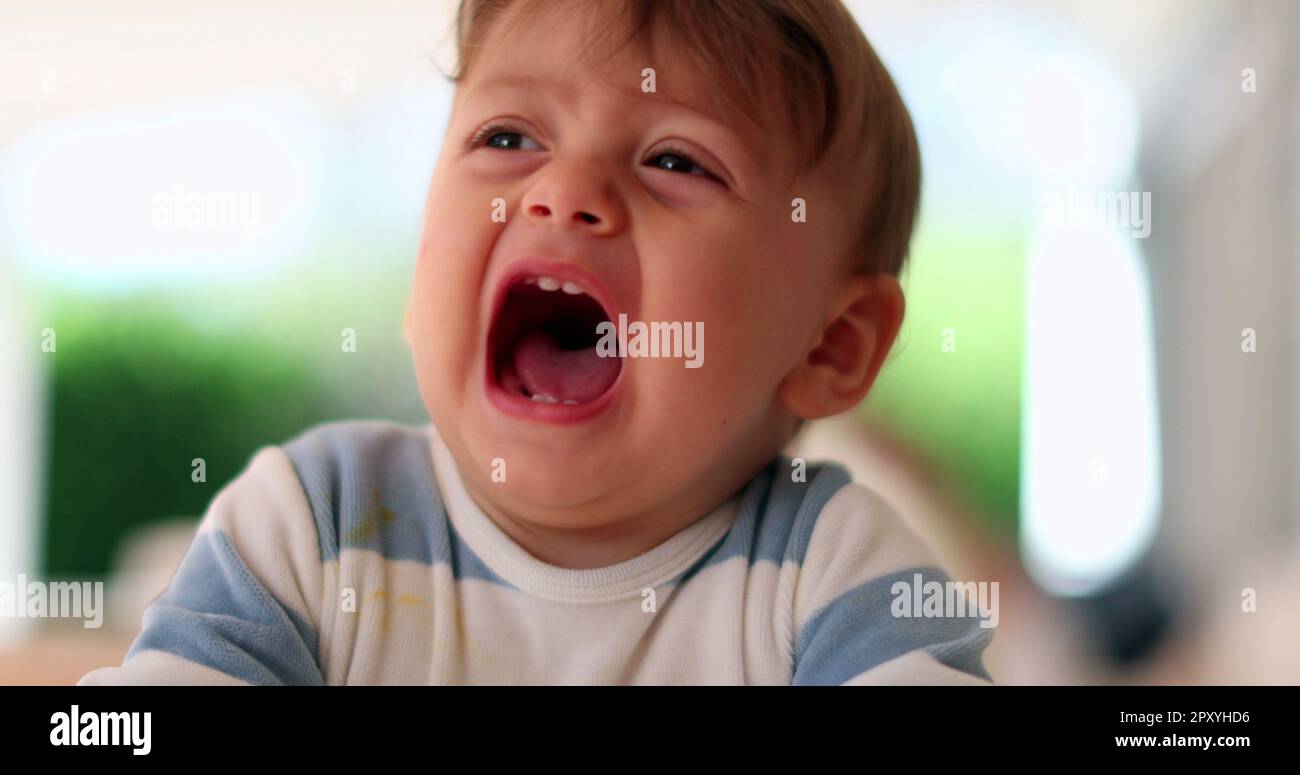 Cute baby complaining crying out loud wanting attention. Toddler ...