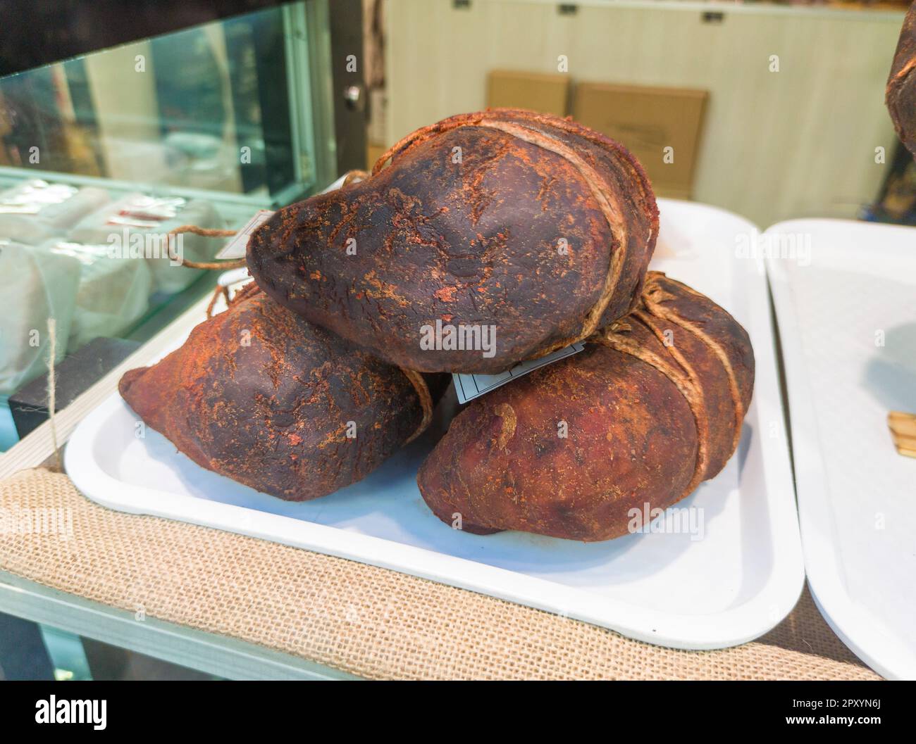 Extremaduran buche displayed at butchers shop. Pork stomach stuffed ...