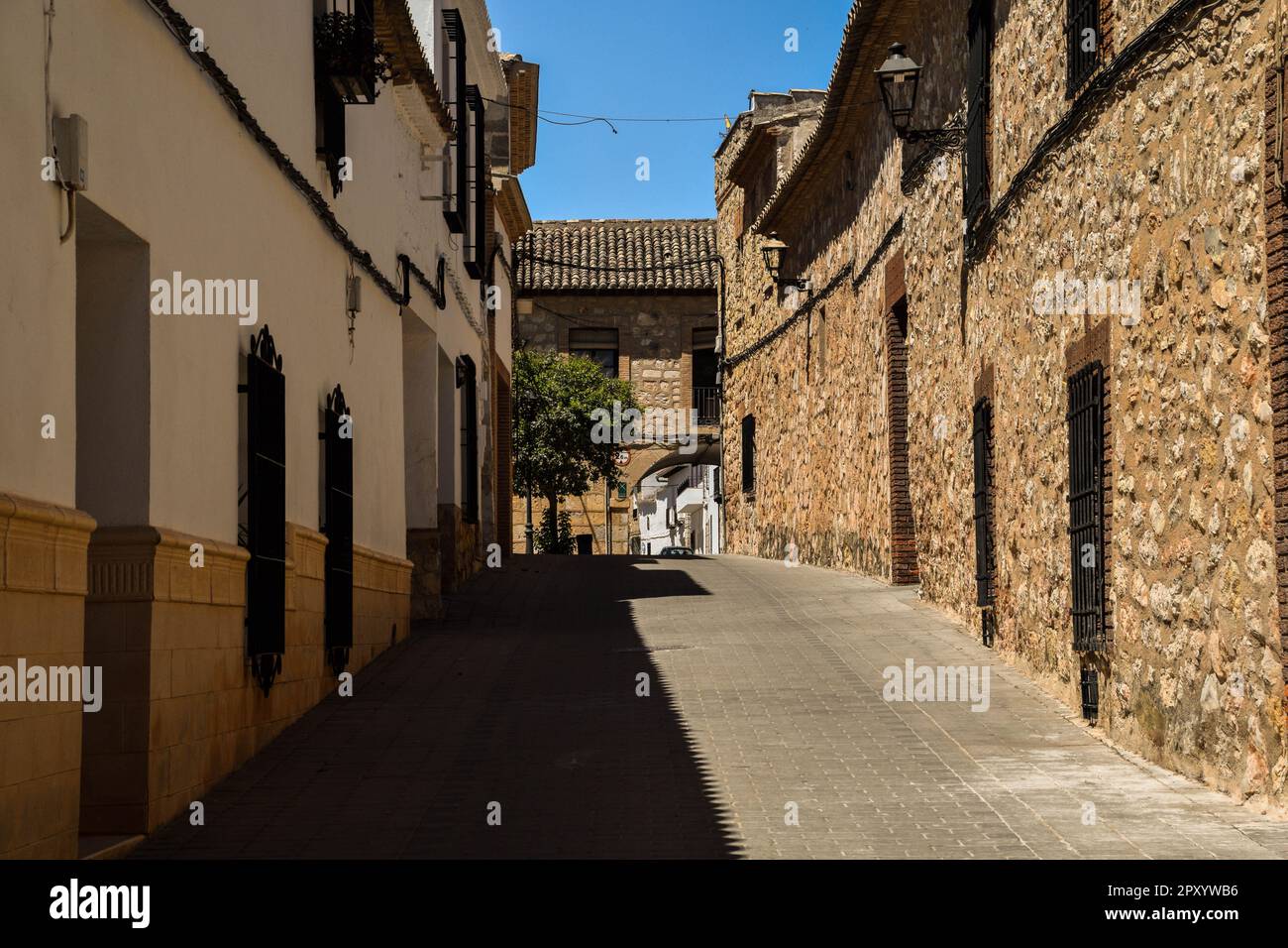 Arch between buildings in town street Stock Photo - Alamy