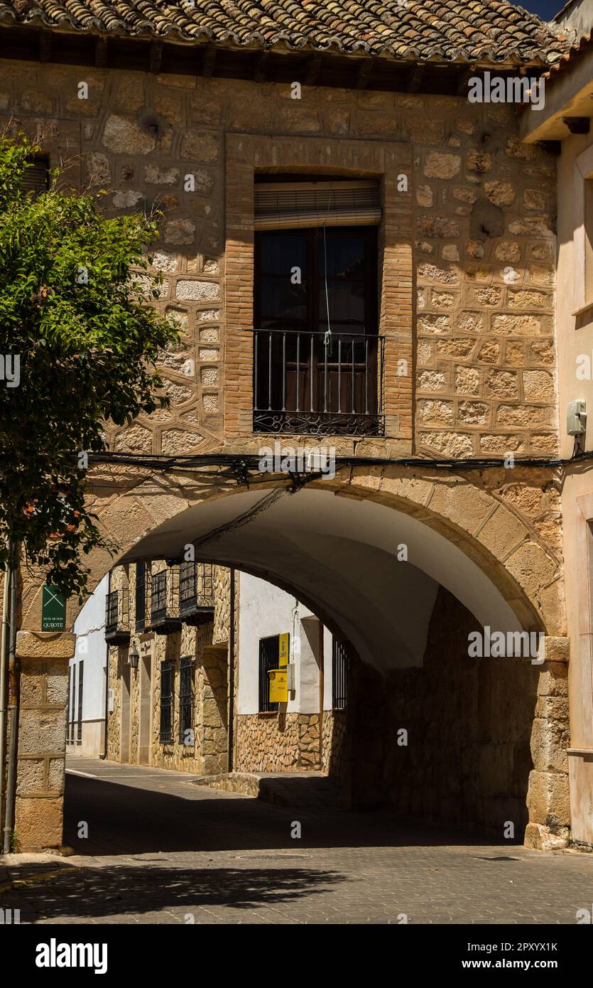 Arch between buildings in town street Stock Photo - Alamy