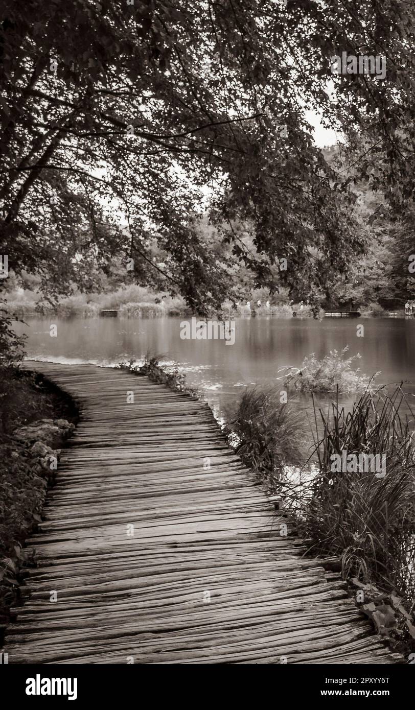 Landscape with footbridge over turquoise water. Plitvice Lakes National ...