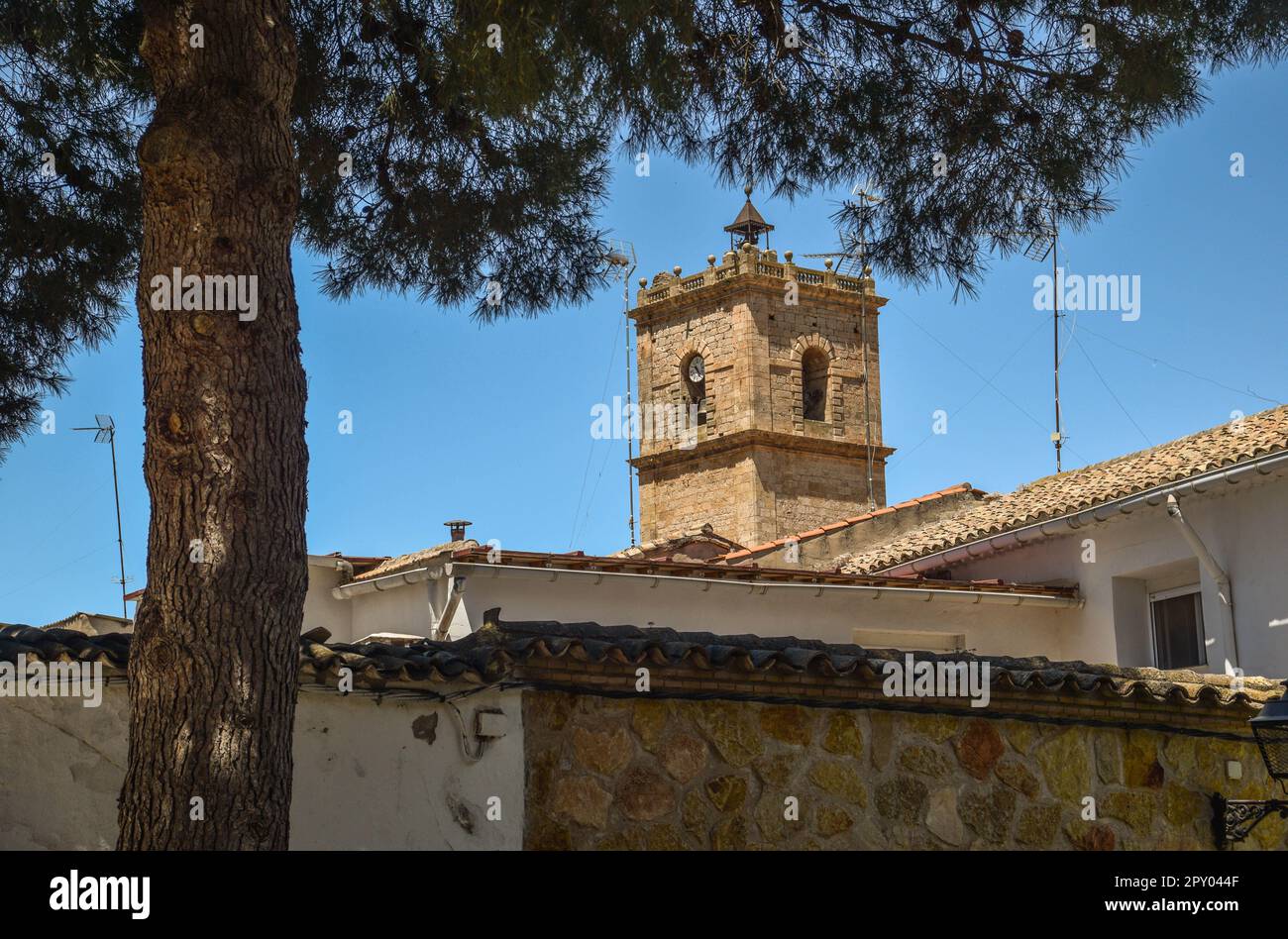 Church bell tower over the rooftops Stock Photo - Alamy