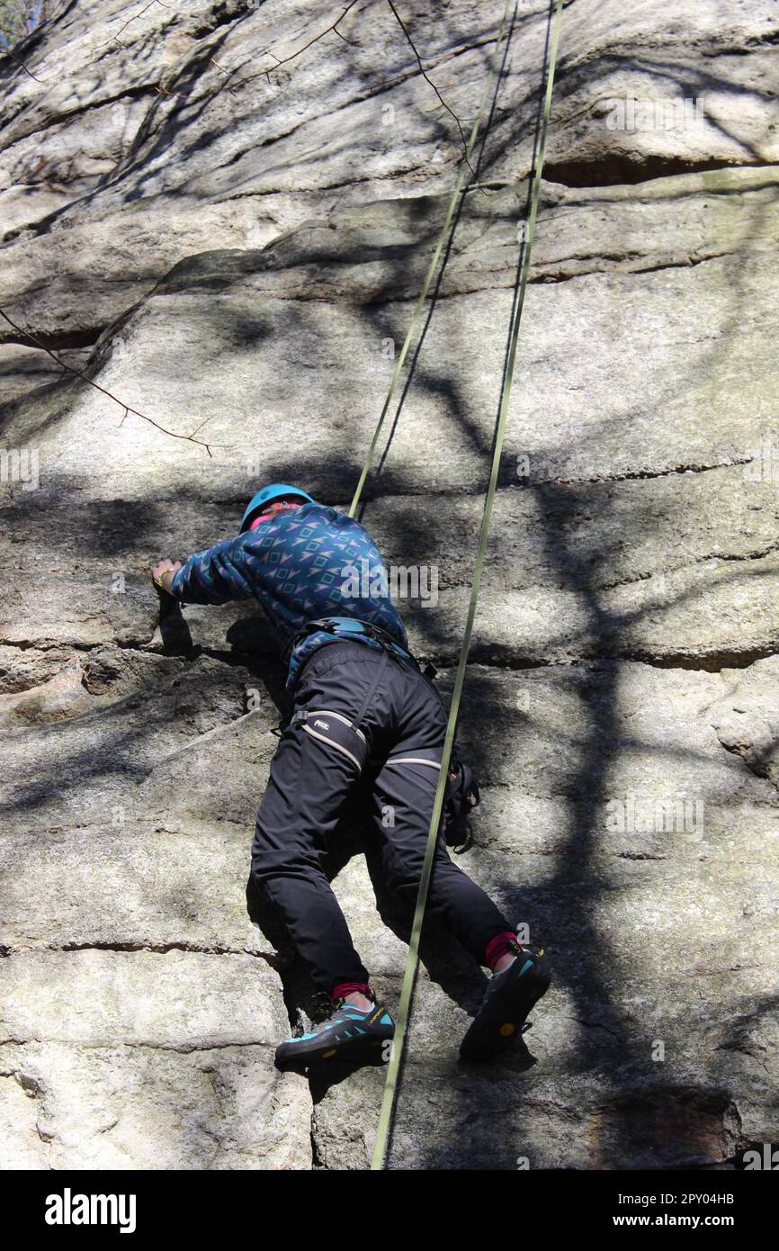 Person latched onto limestone, rock climbing at Peter's Kill in ...