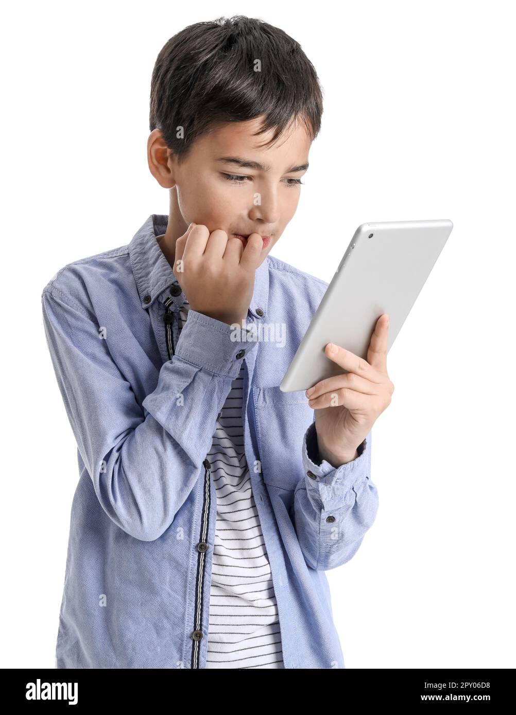 Little boy with tablet computer biting nails on white background Stock ...