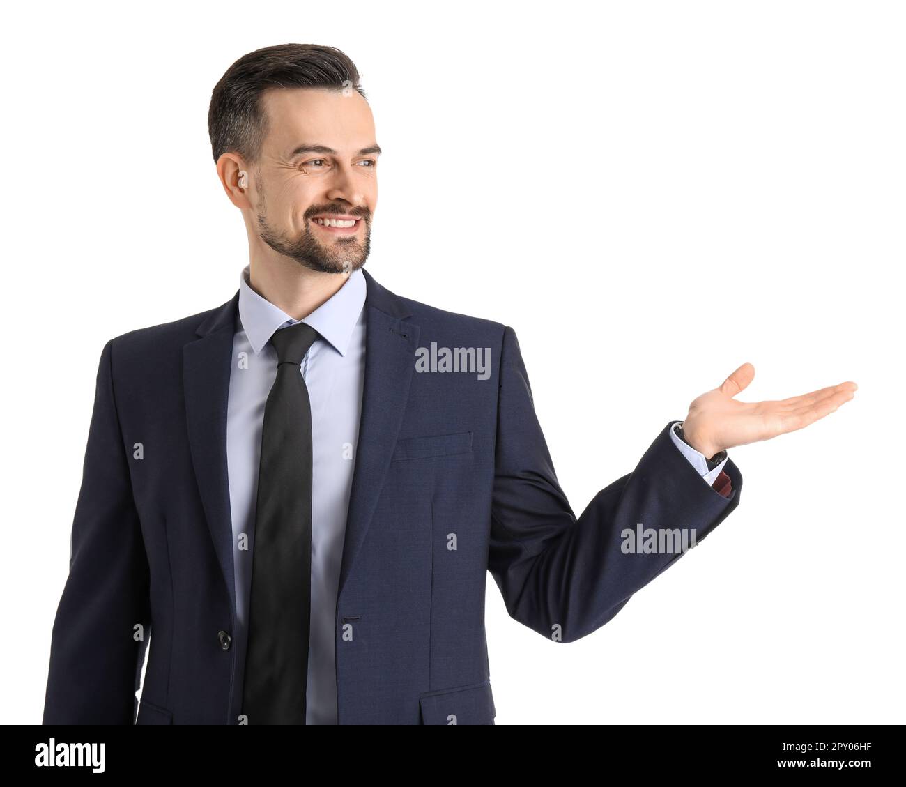 Handsome businessman showing something on white background Stock Photo ...