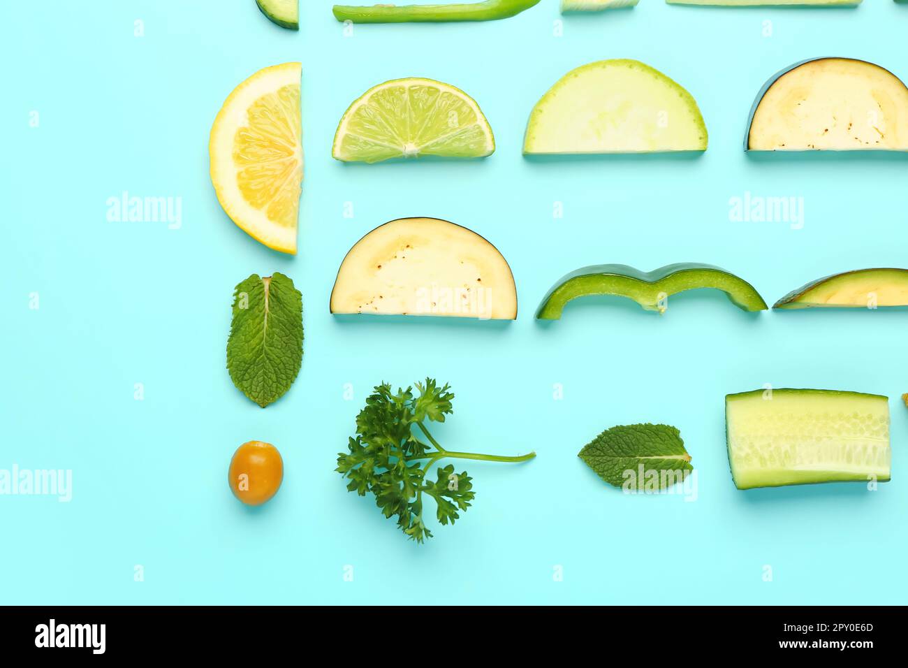 Composition with fresh fruits and vegetables on turquoise background ...