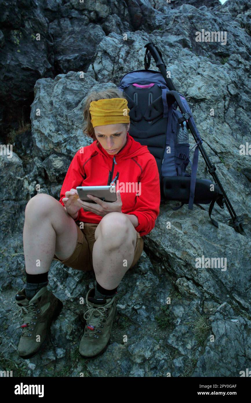 hiker using portable tablet technology Stock Photo - Alamy