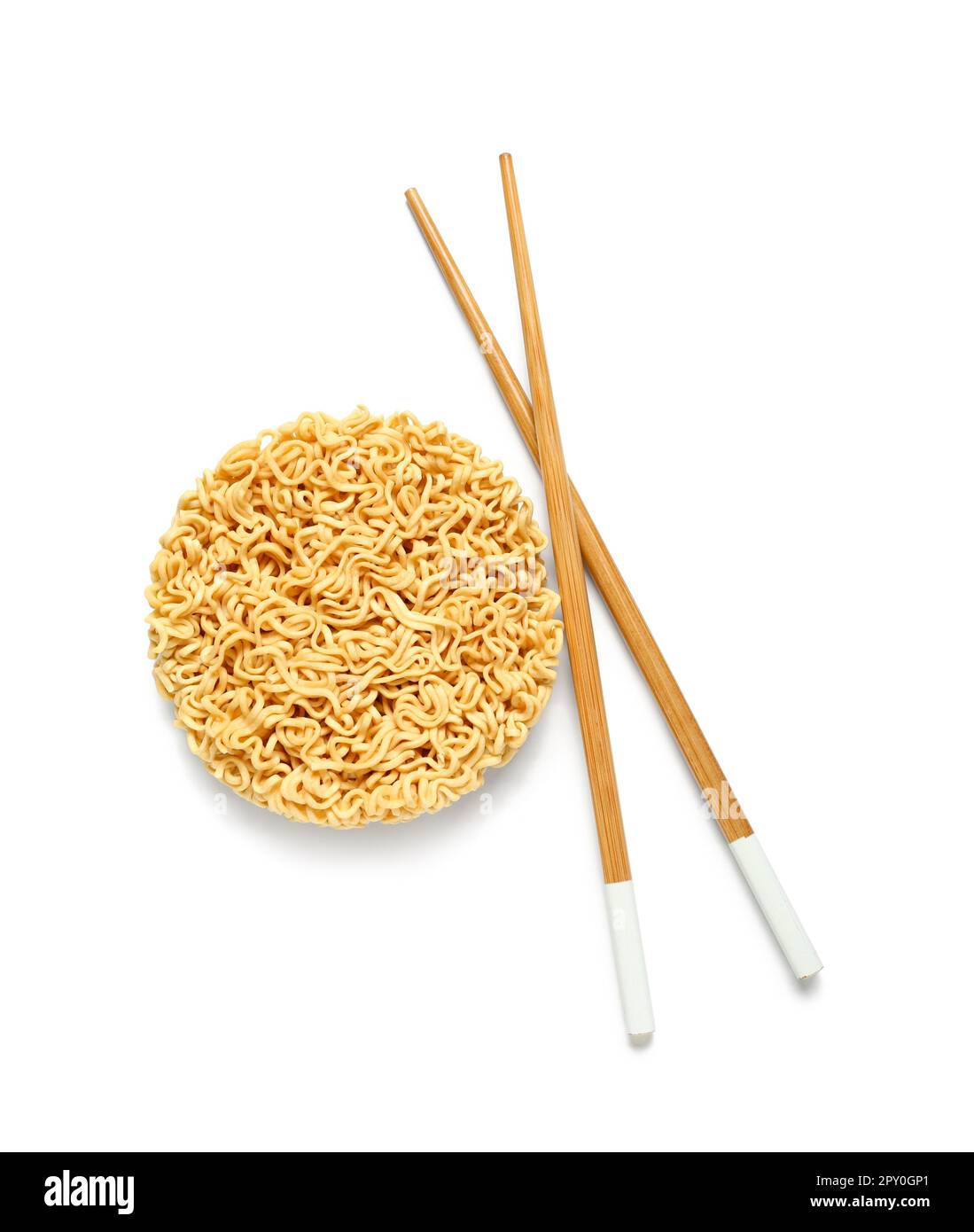 Raw instant noodles and wooden chopsticks on white background Stock ...