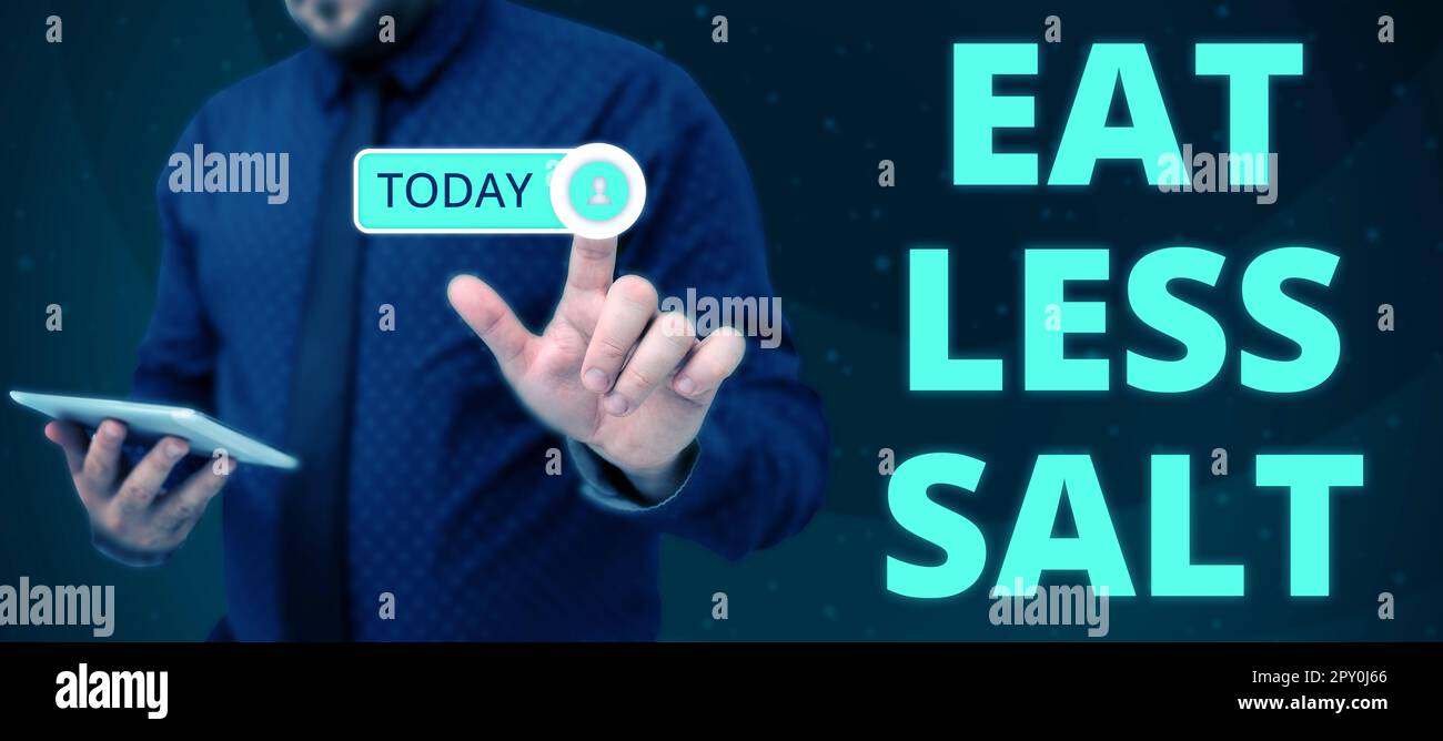 Sign displaying Eat Less Salt, Business showcase reducing the sodium ...