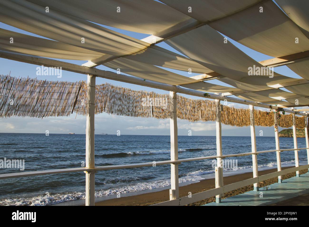 Cozy terrace on the beach, idyllic view of the seashore. Tropical ...