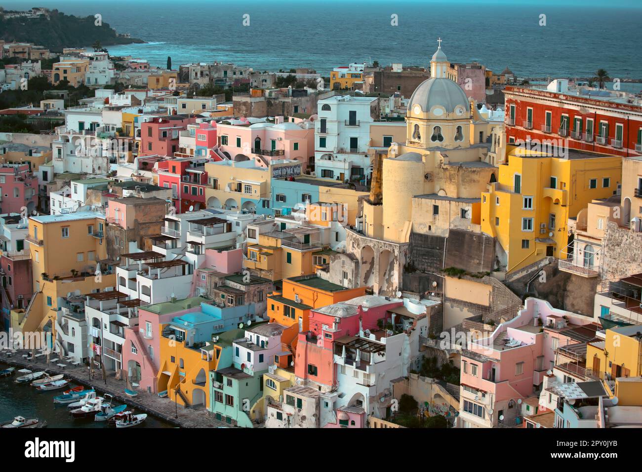 View of the Port of Corricella with lots of colorful houses in the ...