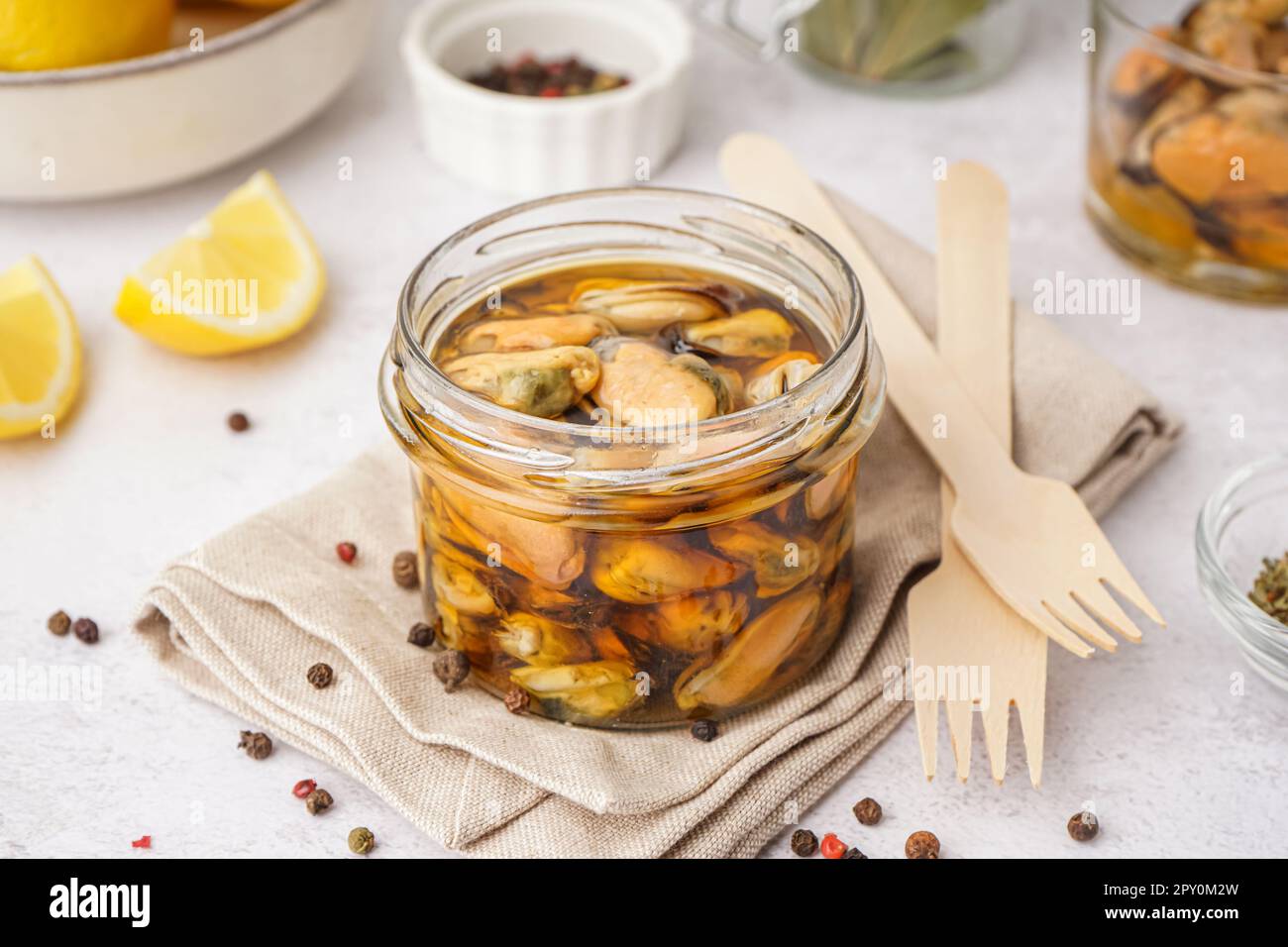 Jar with pickled mussels on white background Stock Photo - Alamy