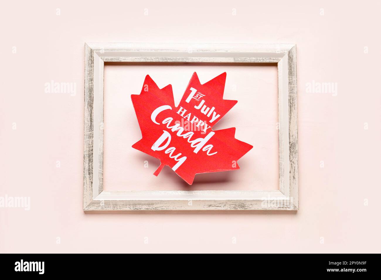 Maple leaf with text 1ST JULY HAPPY CANADA DAY and frame on white ...