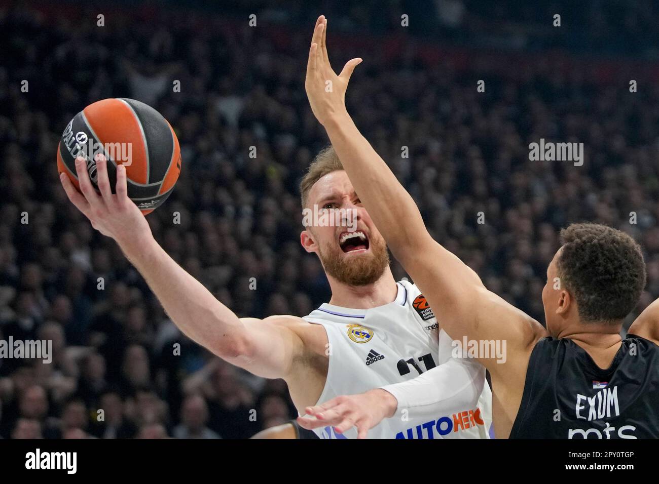 Real Madrid's Dzanan Musa, left, tries to score as Partizan's Dante ...