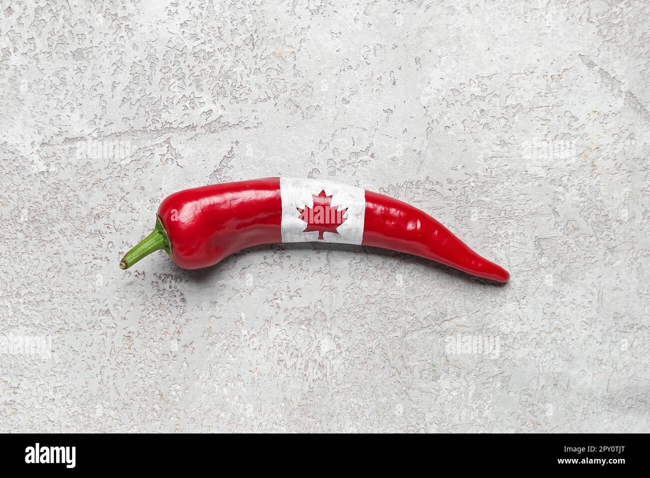 Chili pepper with drawn flag of Canada on grunge background Stock Photo ...