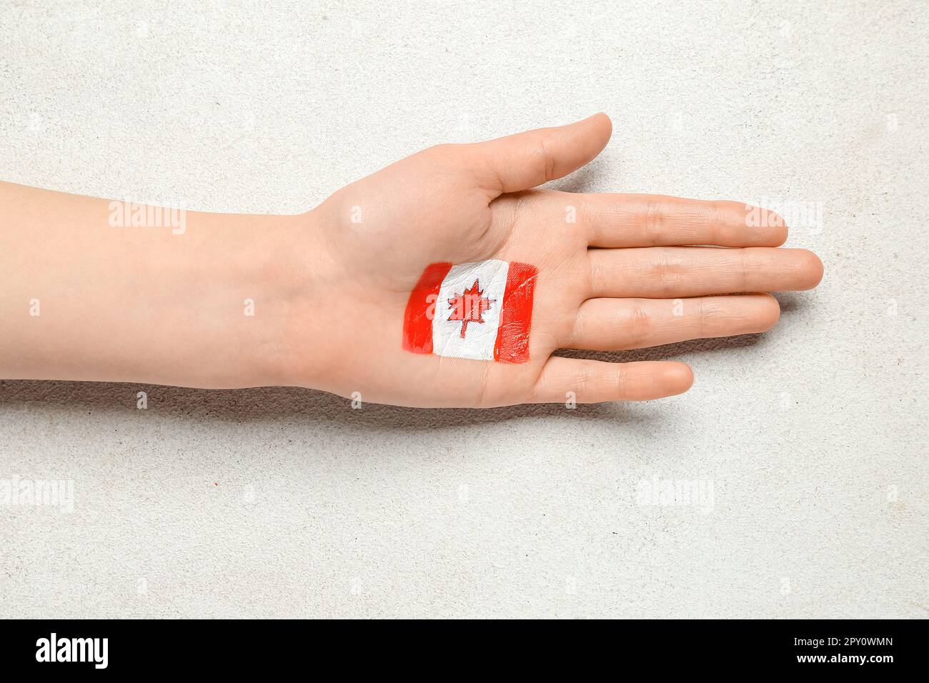 Female hand with drawn flag of Canada on white background Stock Photo ...